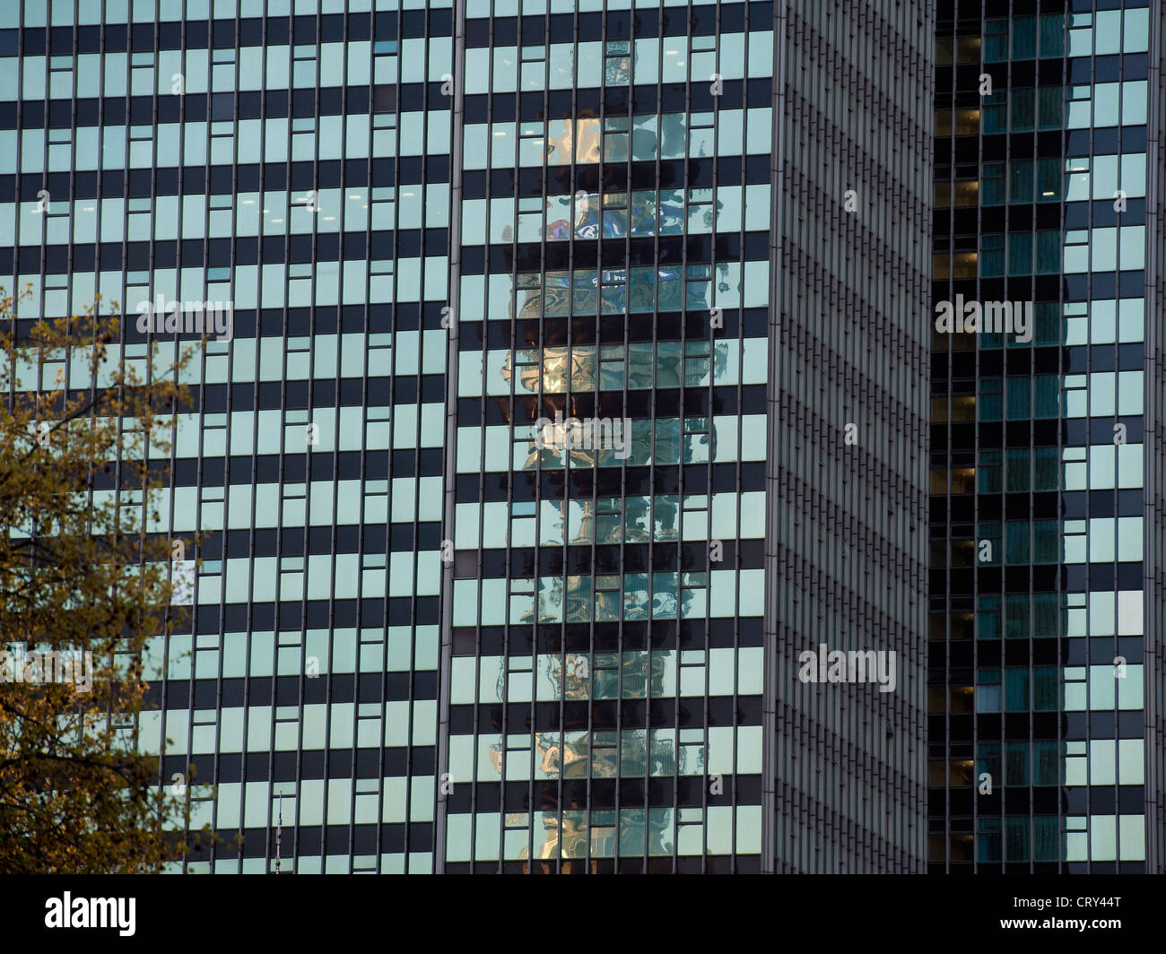 The post office tower is reflected in the windows of an office block ...
