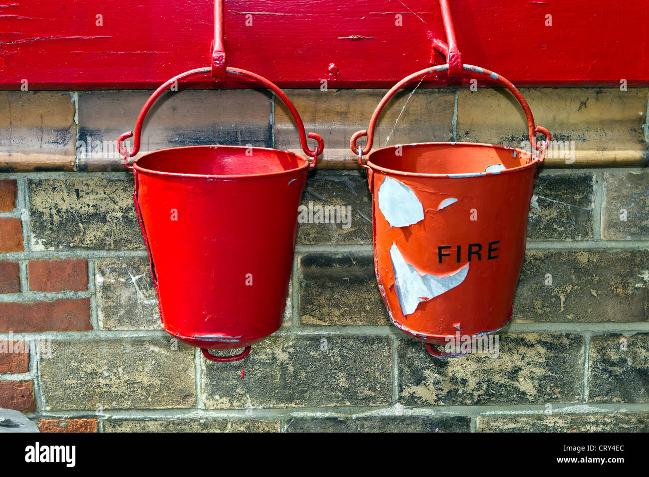 a collection of three fire buckets at a steam railway station Stock ...