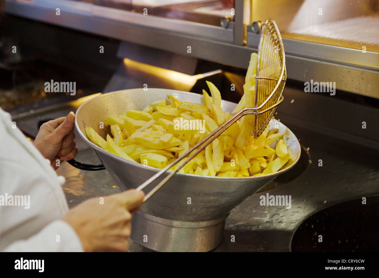 Chips being fried in traditional British chip shop Gloucestershire, UK ...