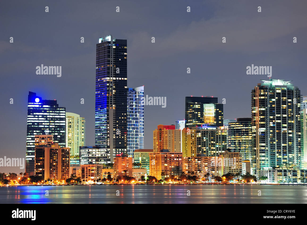 Miami city architecture closeup at dusk with urban skyscrapers over sea ...