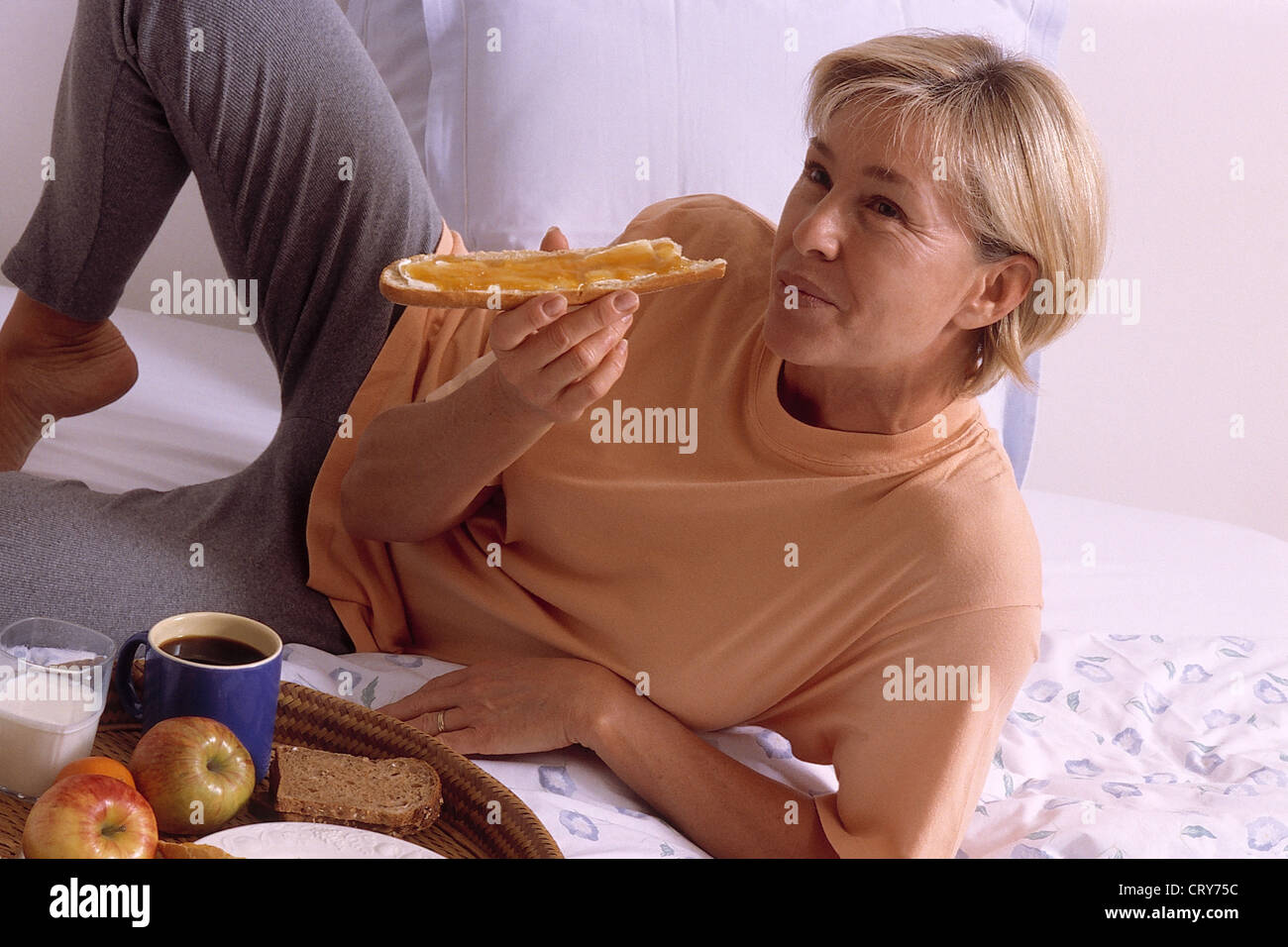 ELDERLY PERSON EATING BREAKFAST Stock Photo - Alamy