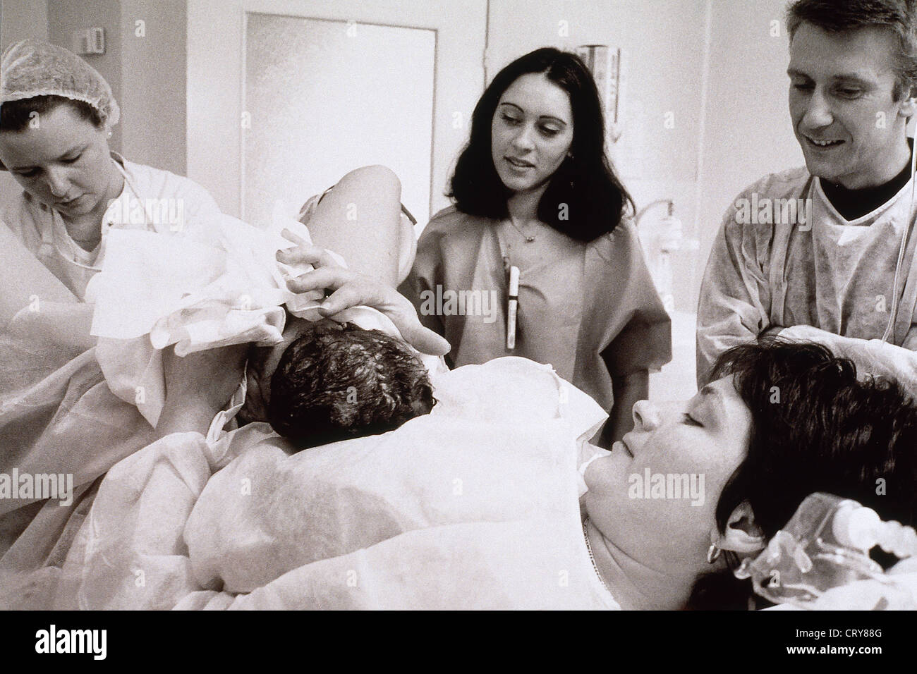 Newborn baby delivery room parents birth hospital hi-res stock ...
