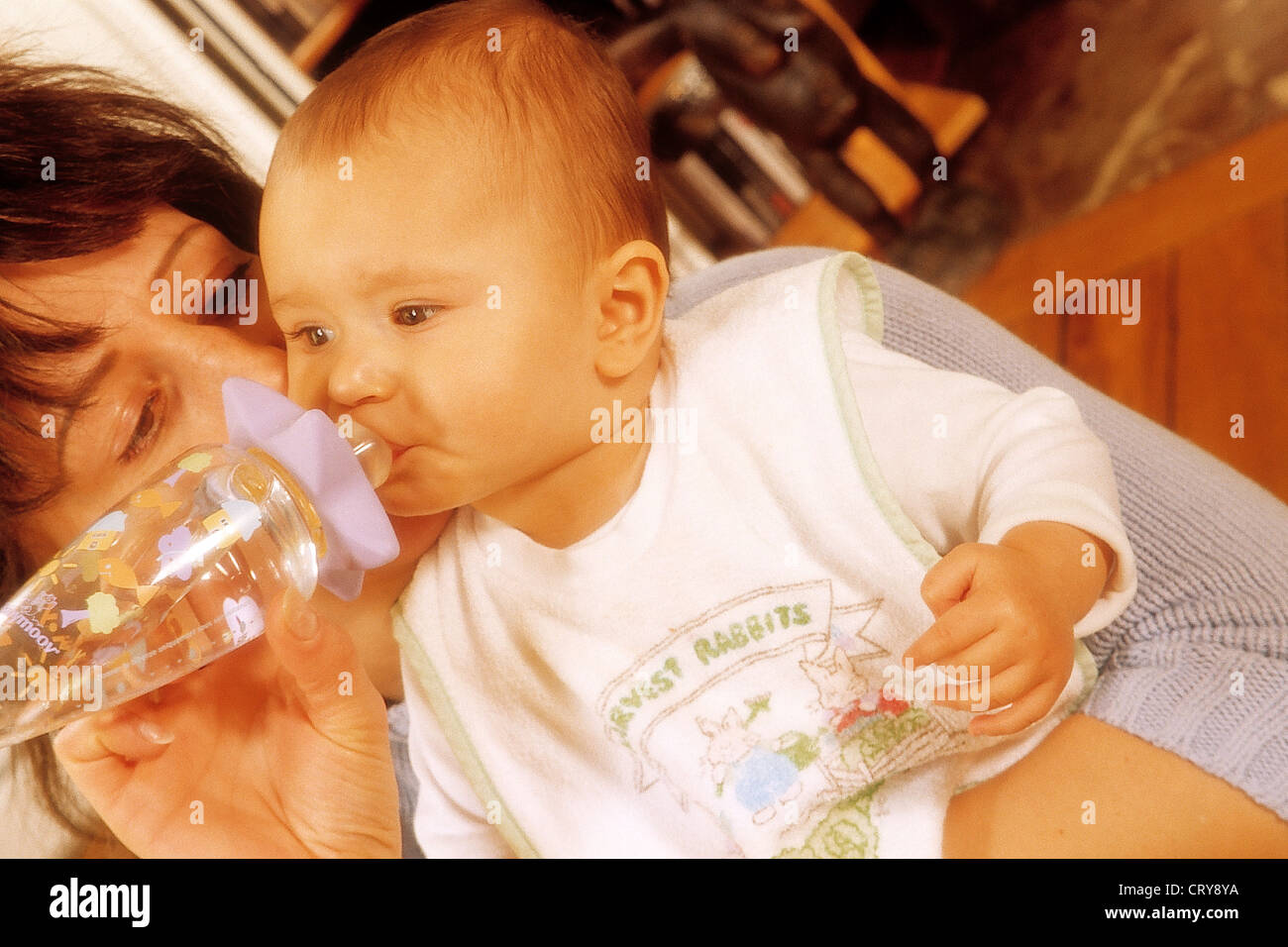 Baby drinks water from bottle hi-res stock photography and images - Alamy
