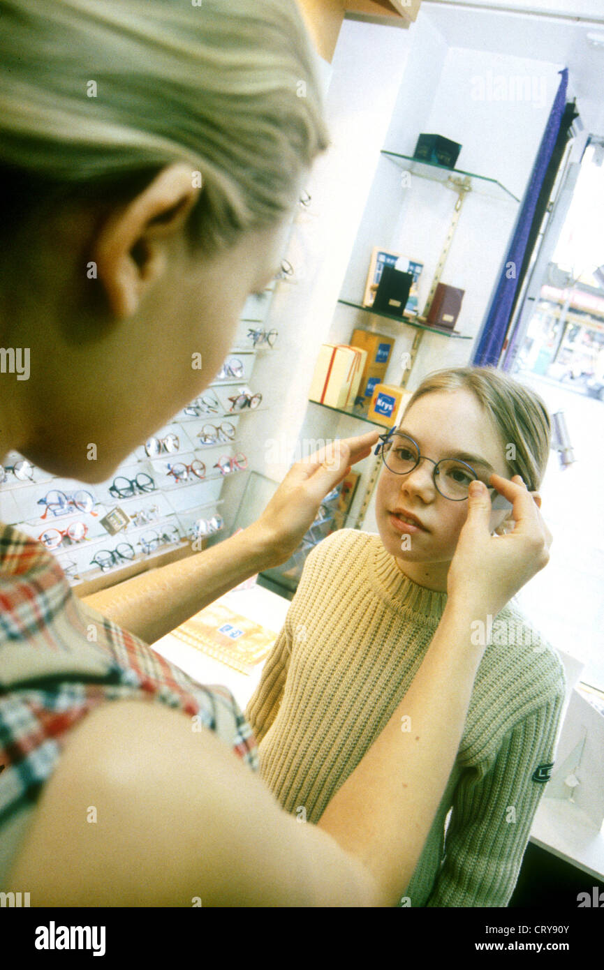 Girl optician trying on glasses hi-res stock photography and images - Alamy