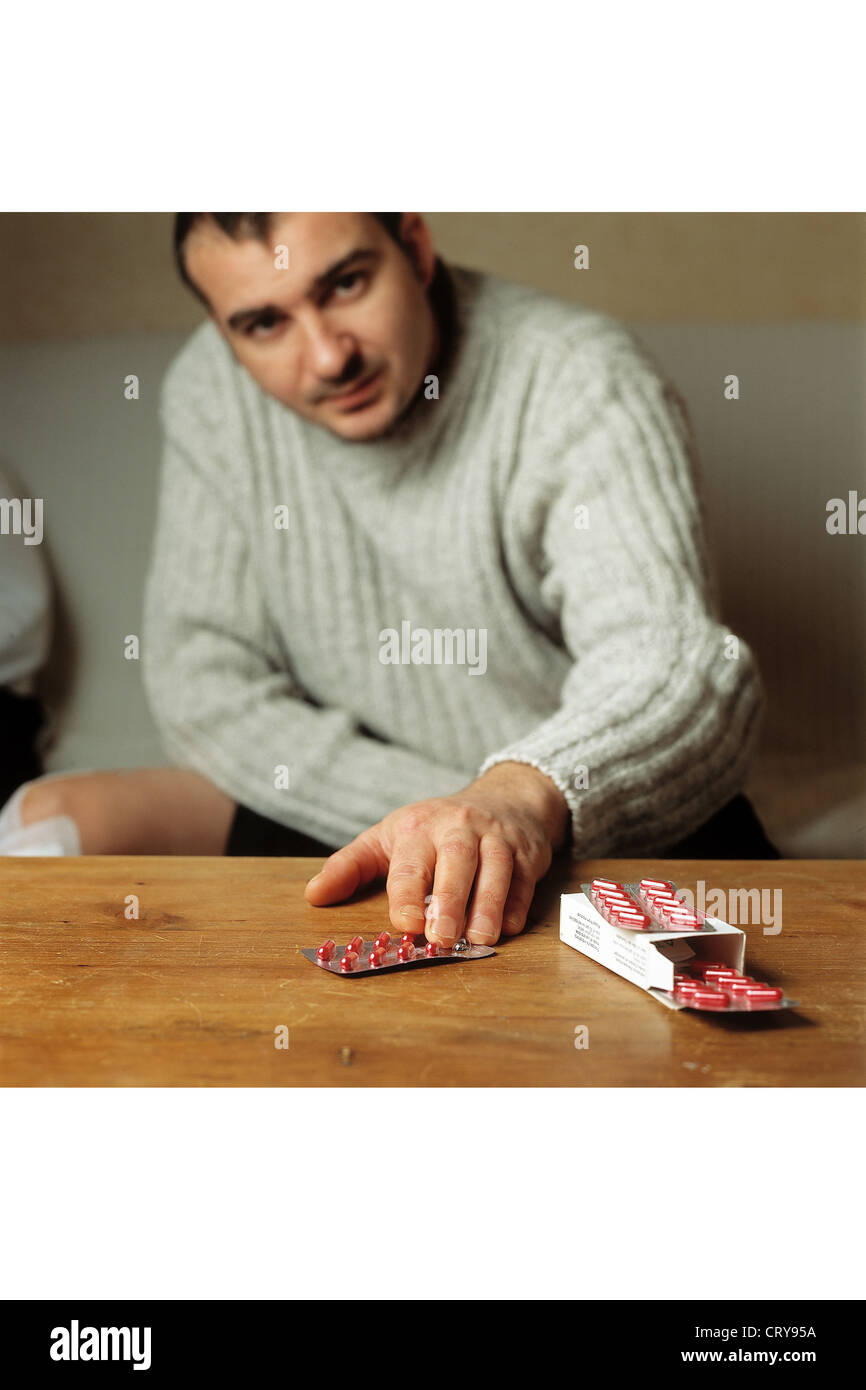 MAN TAKING MEDICATION Stock Photo - Alamy