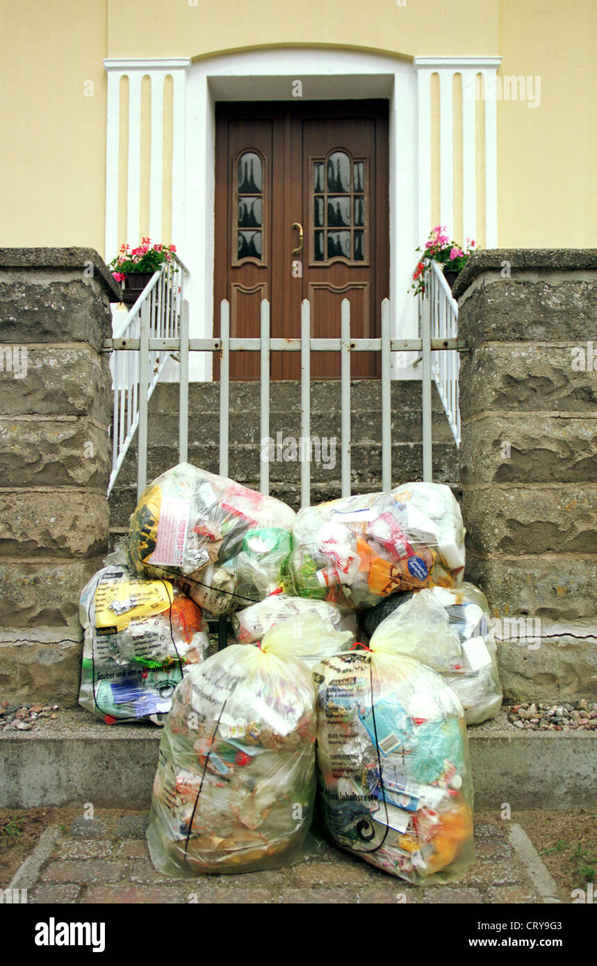 Yellow garbage bags piled up in front of your doorstep Stock Photo - Alamy