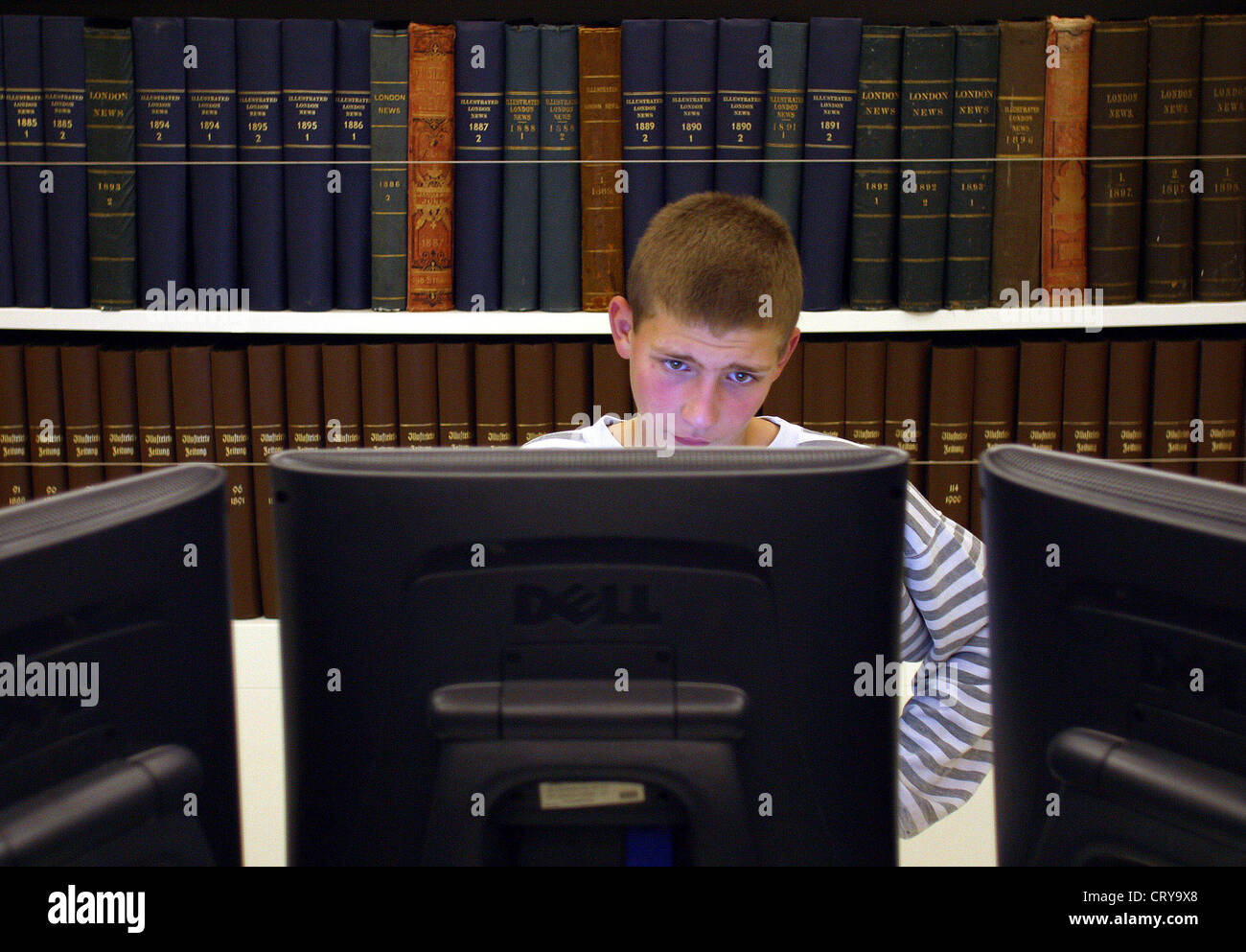 Dortmund, boy between computers and books, DASA Museum Stock Photo - Alamy