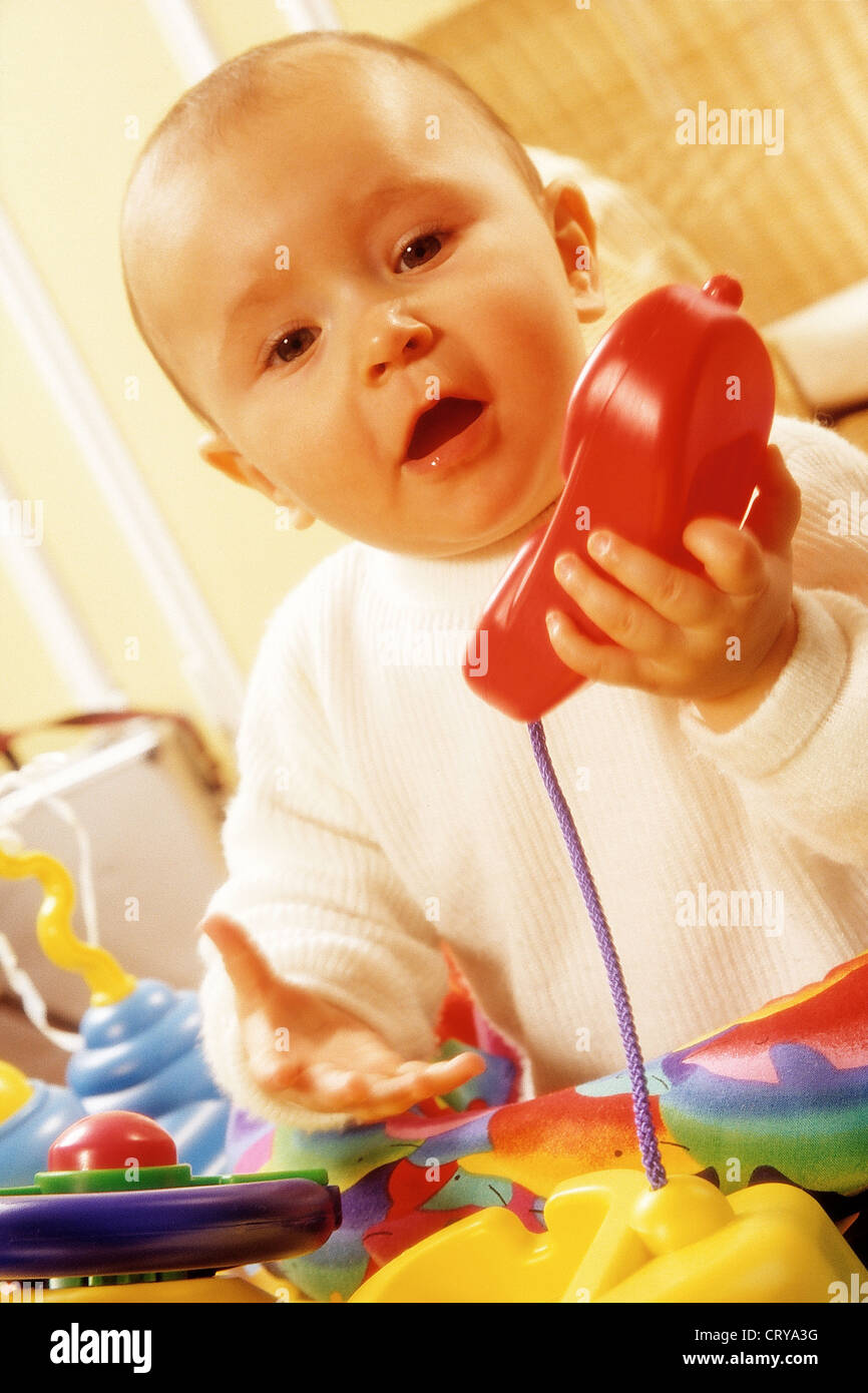 INFANT PLAYING INDOORS Stock Photo - Alamy