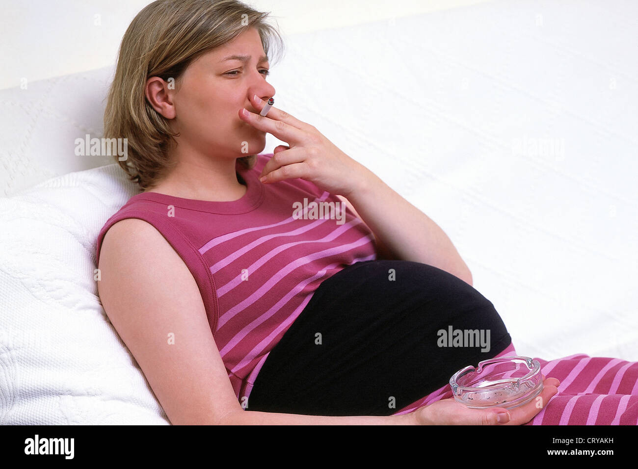 PREGNANT WOMAN SMOKING Stock Photo - Alamy