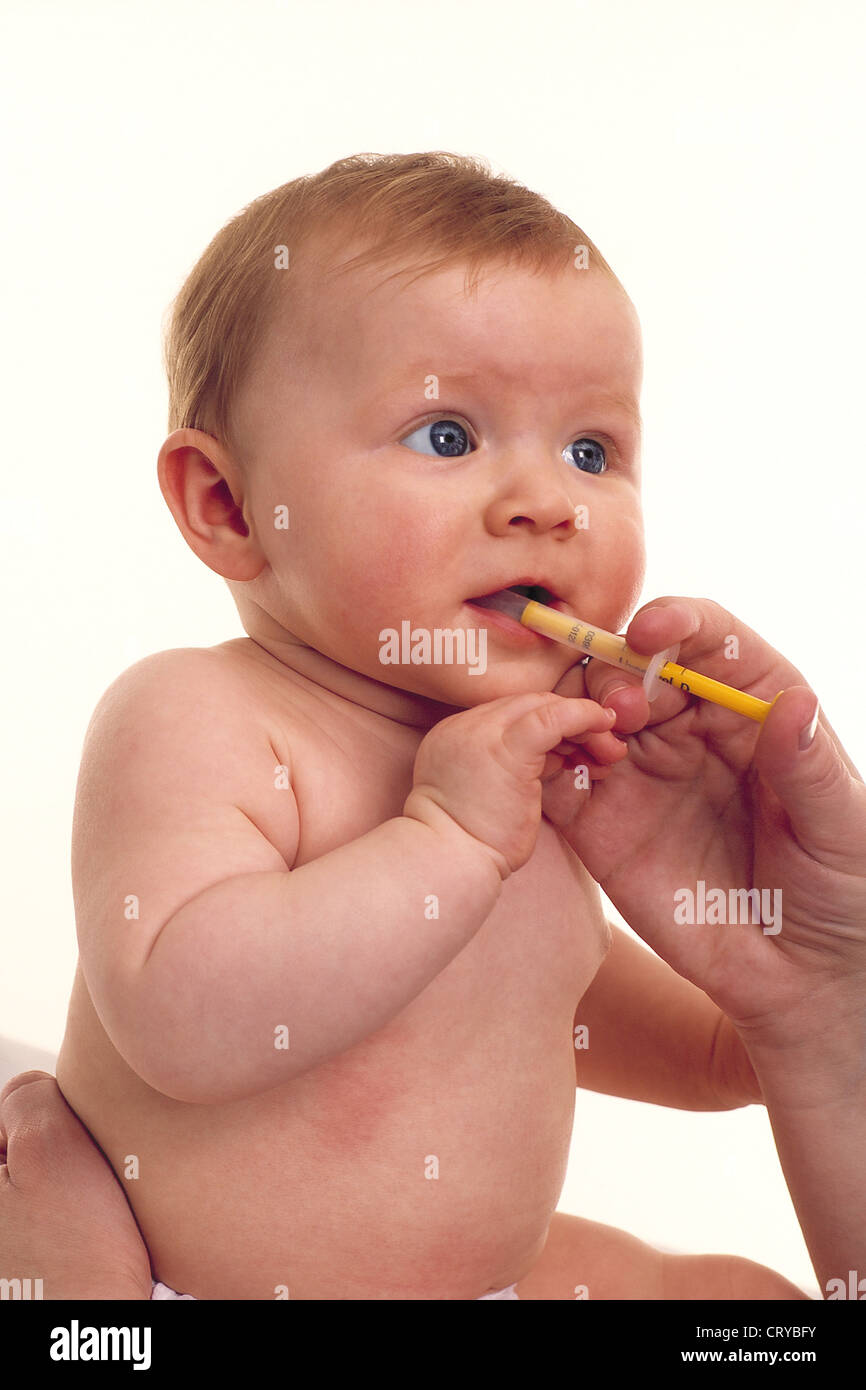 INFANT TAKING MEDICATION Stock Photo - Alamy
