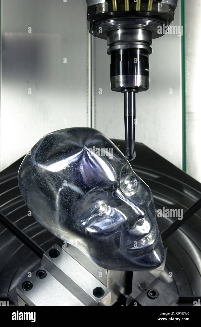 A milling machine produces the image of a human head Stock Photo - Alamy