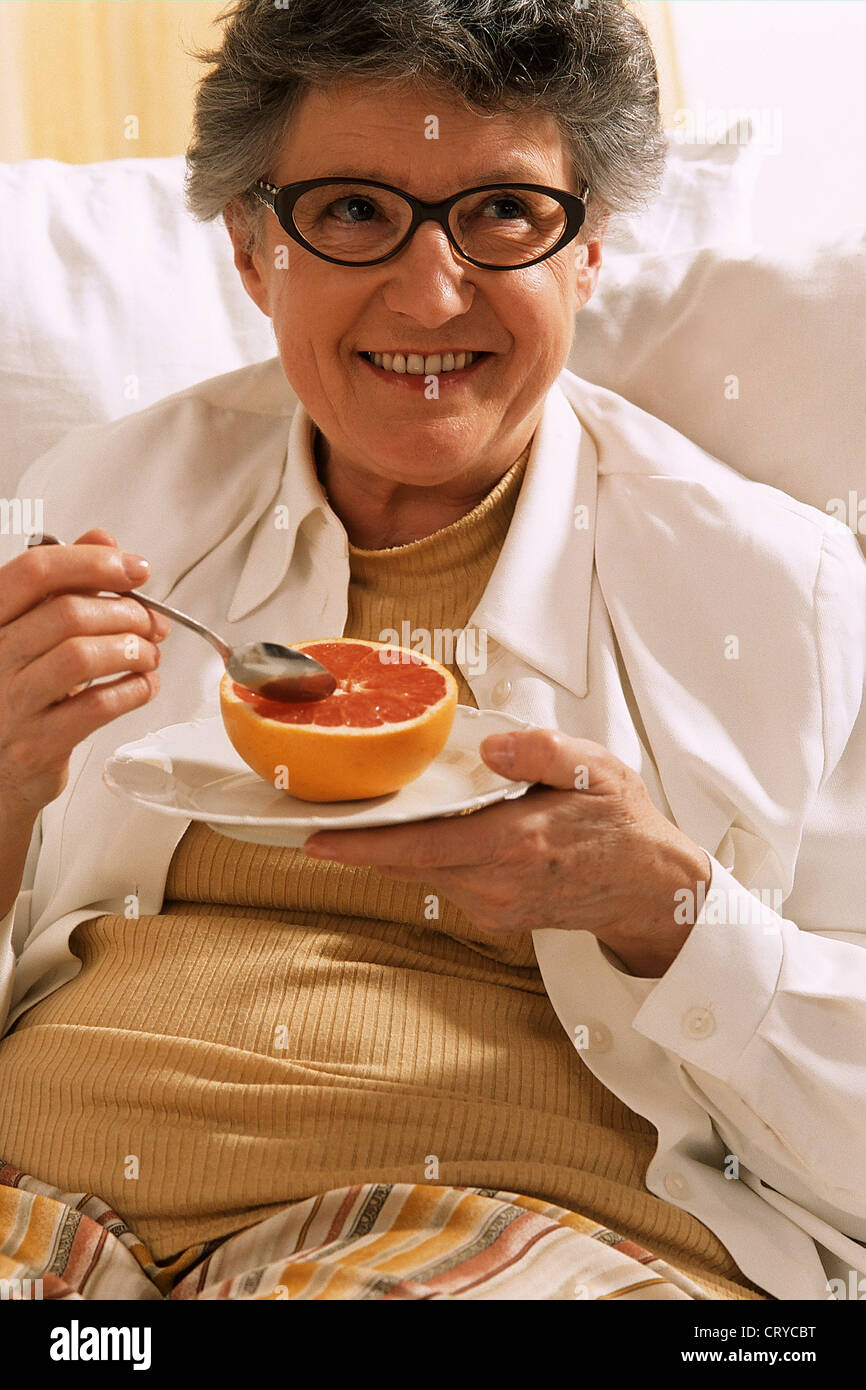 ELDERLY PERSON EATING FRUIT Stock Photo - Alamy