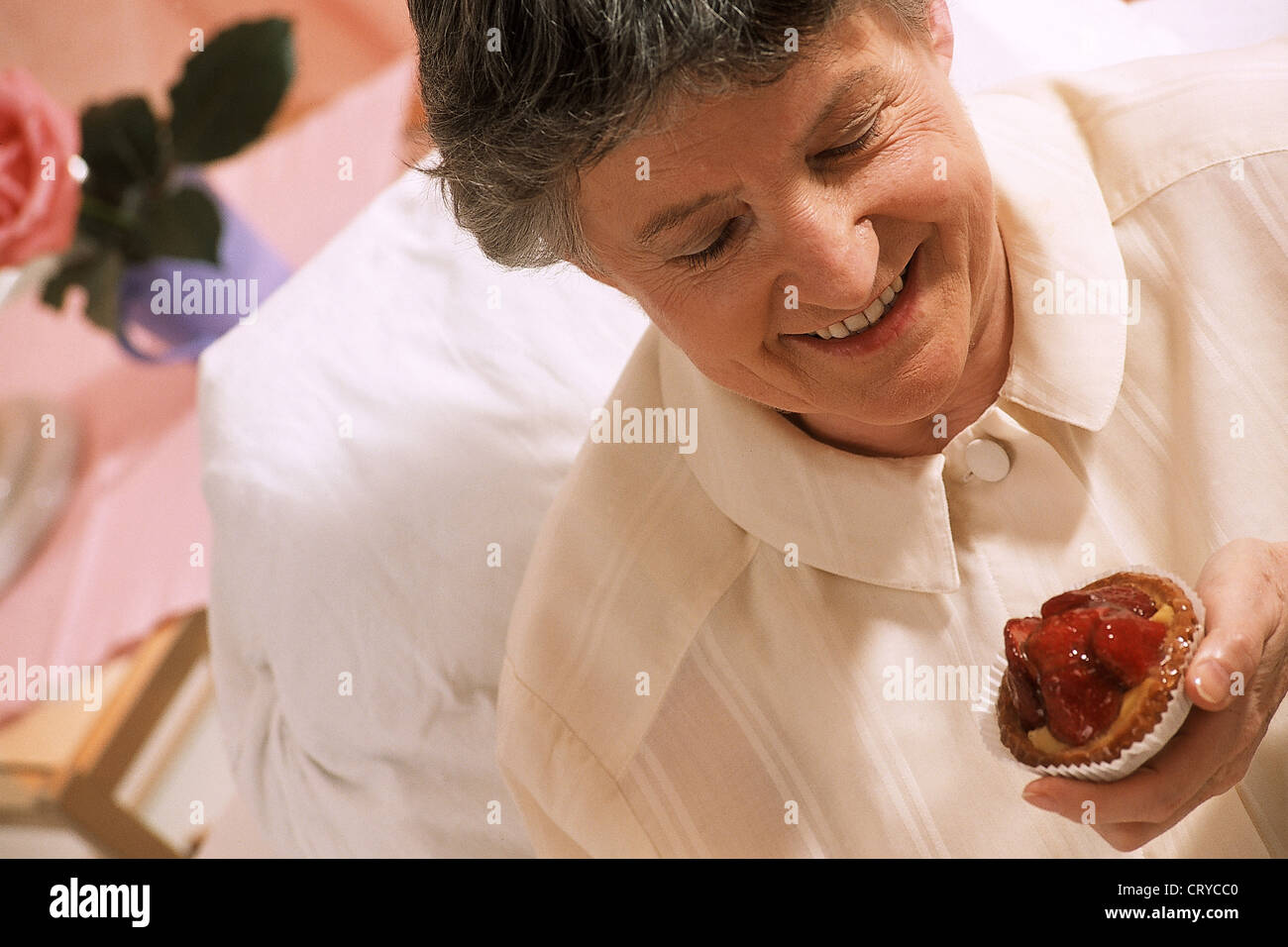 ELDERLY PERSON EATING SWEETS Stock Photo - Alamy