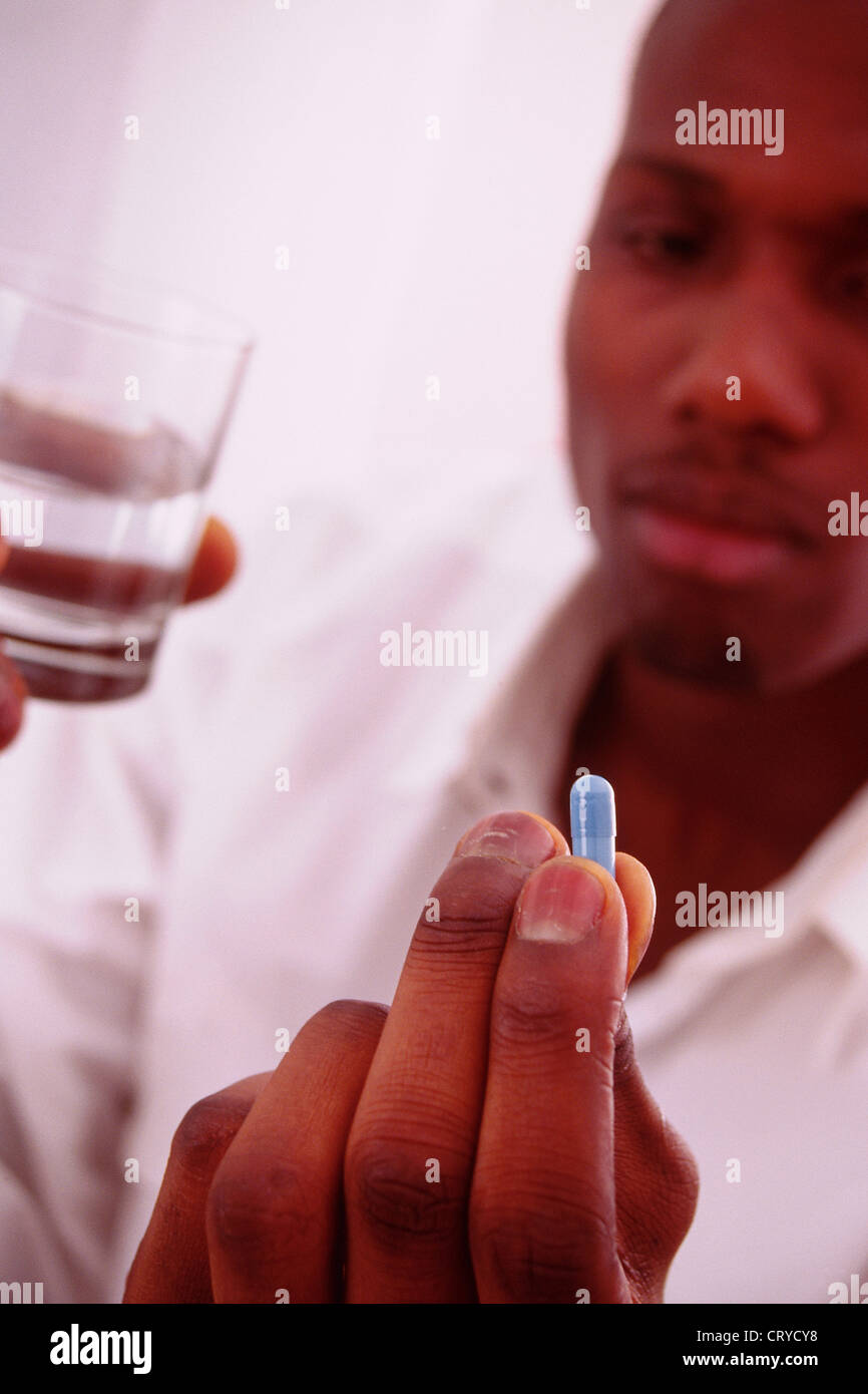 MAN TAKING MEDICATION Stock Photo - Alamy