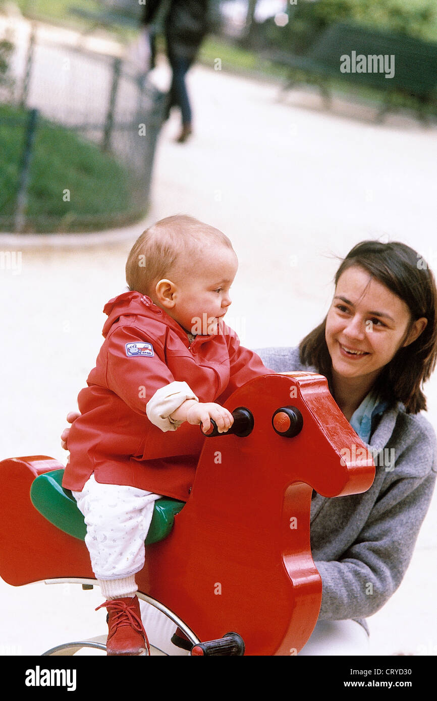 INFANT PLAYING OUTDOORS Stock Photo - Alamy