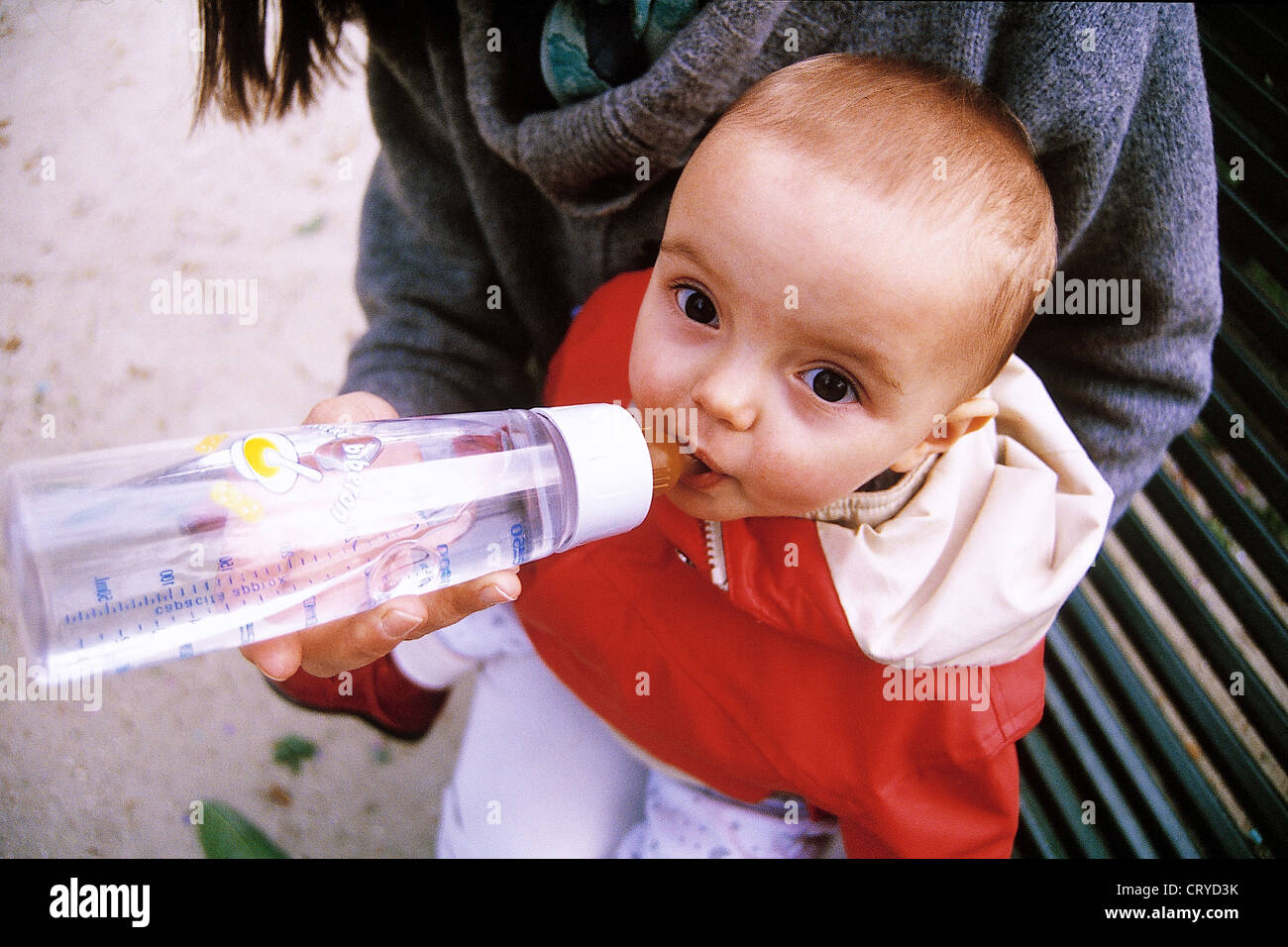 Baby drinks water from bottle hi-res stock photography and images - Alamy