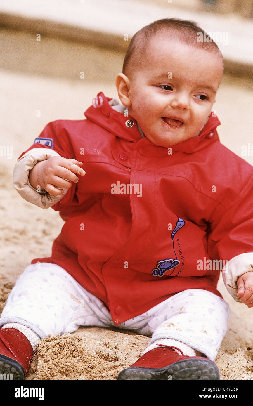 INFANT PLAYING OUTDOORS Stock Photo - Alamy