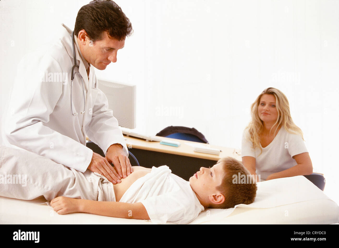 Paediatrician child examination tummy hi-res stock photography and ...