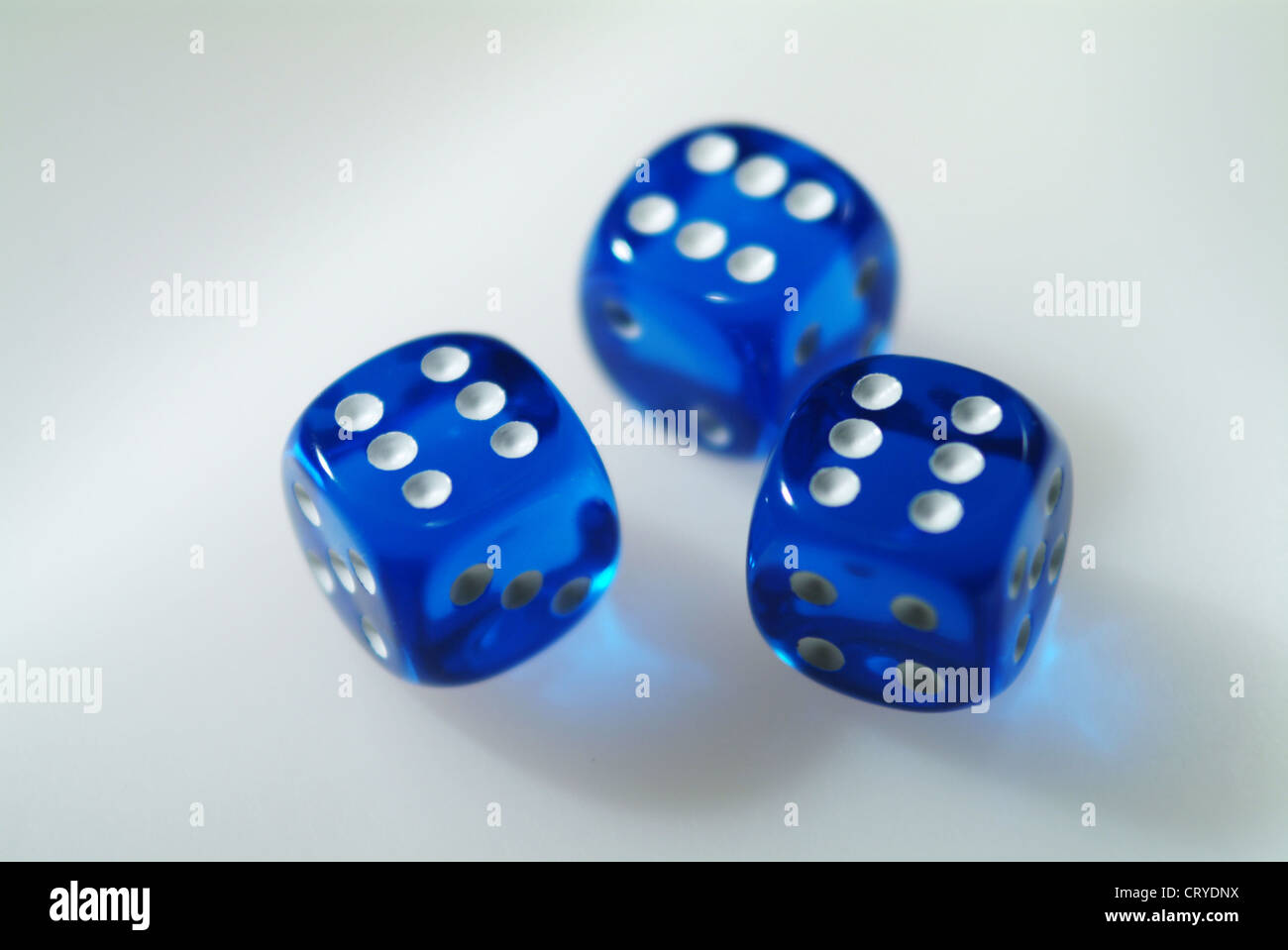 three blue dice with six-Pasch Stock Photo - Alamy