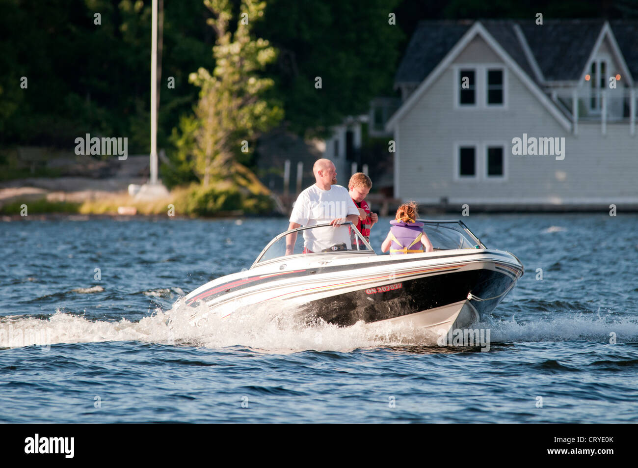Boat returning home Stock Photo - Alamy