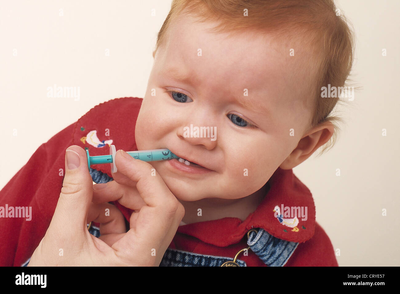INFANT TAKING MEDICATION Stock Photo - Alamy