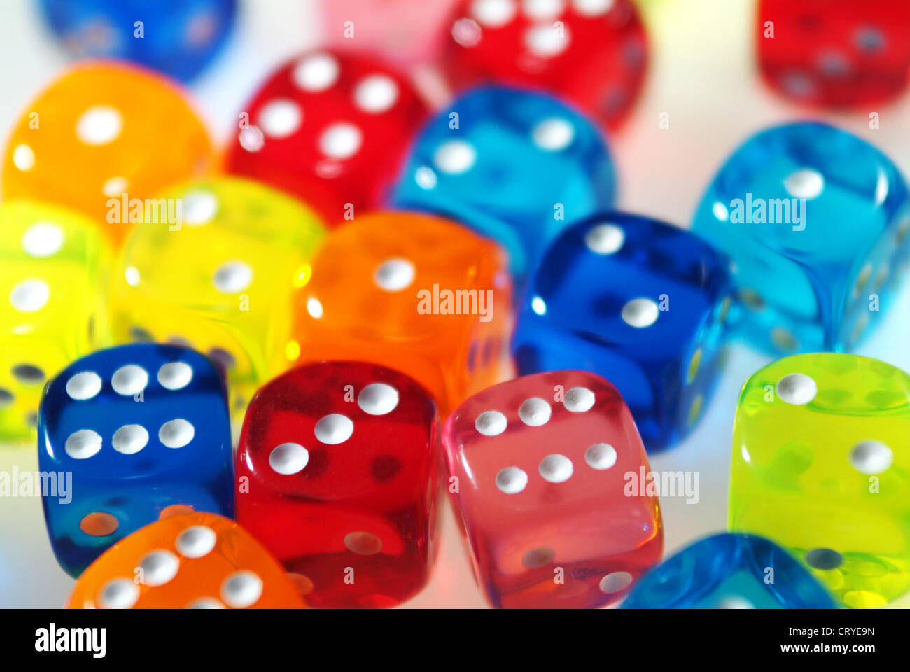 many different colored dice Stock Photo - Alamy