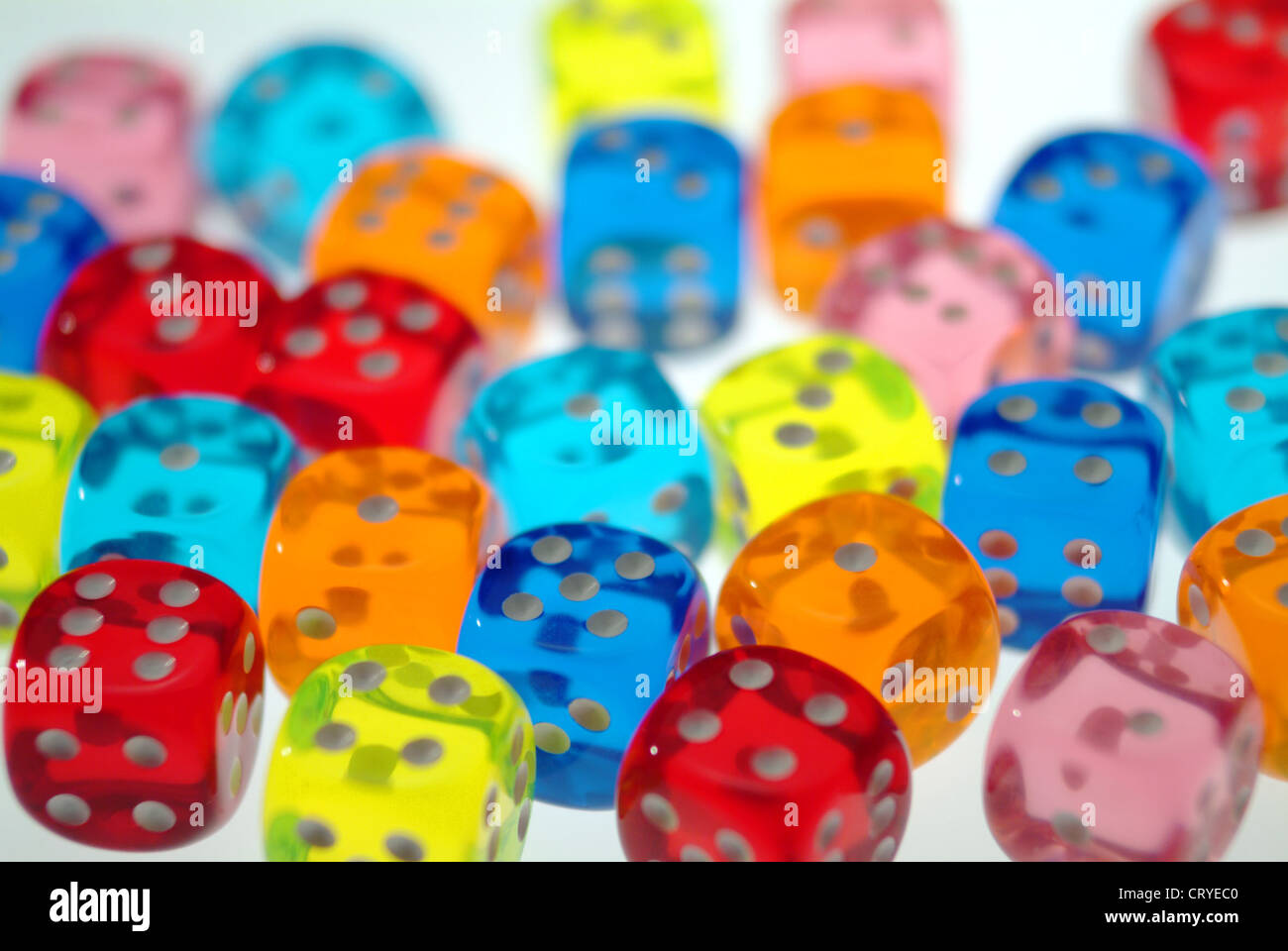 many different colored dice Stock Photo - Alamy