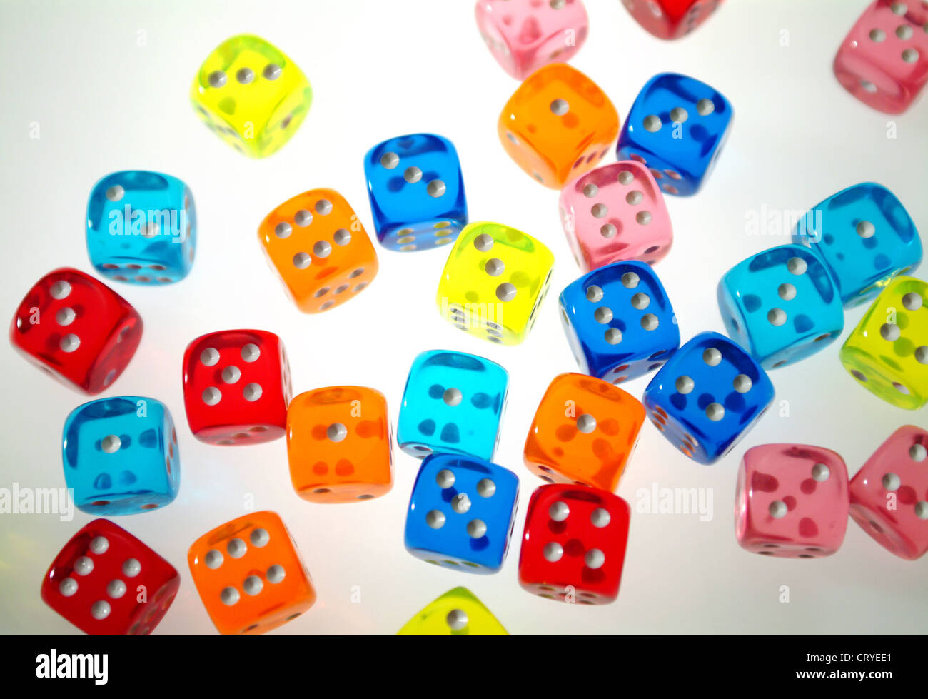 many different colored dice Stock Photo - Alamy