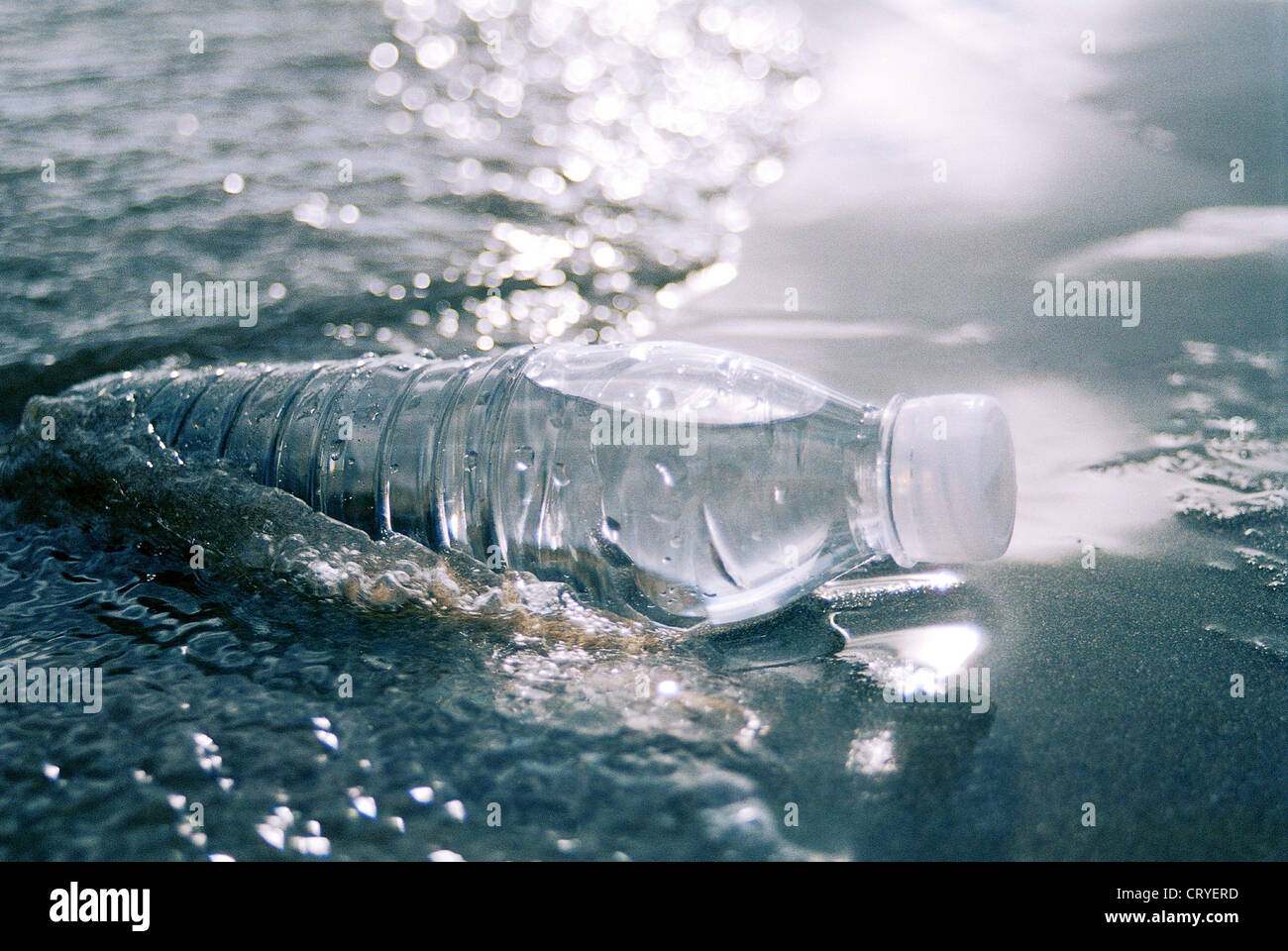Water bottle on the beach Stock Photo - Alamy