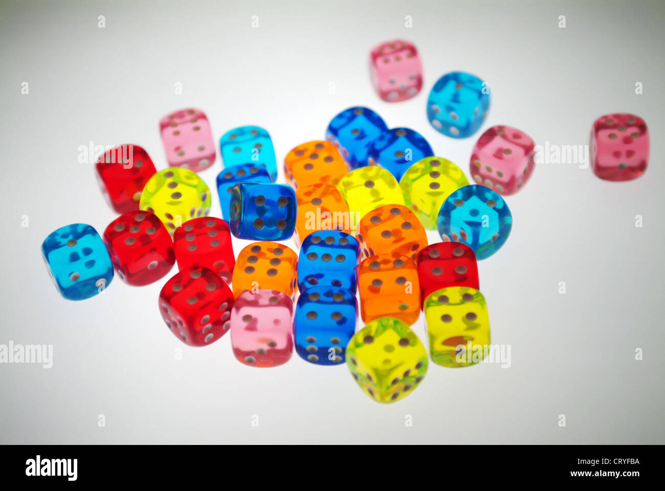 many different colored dice Stock Photo - Alamy