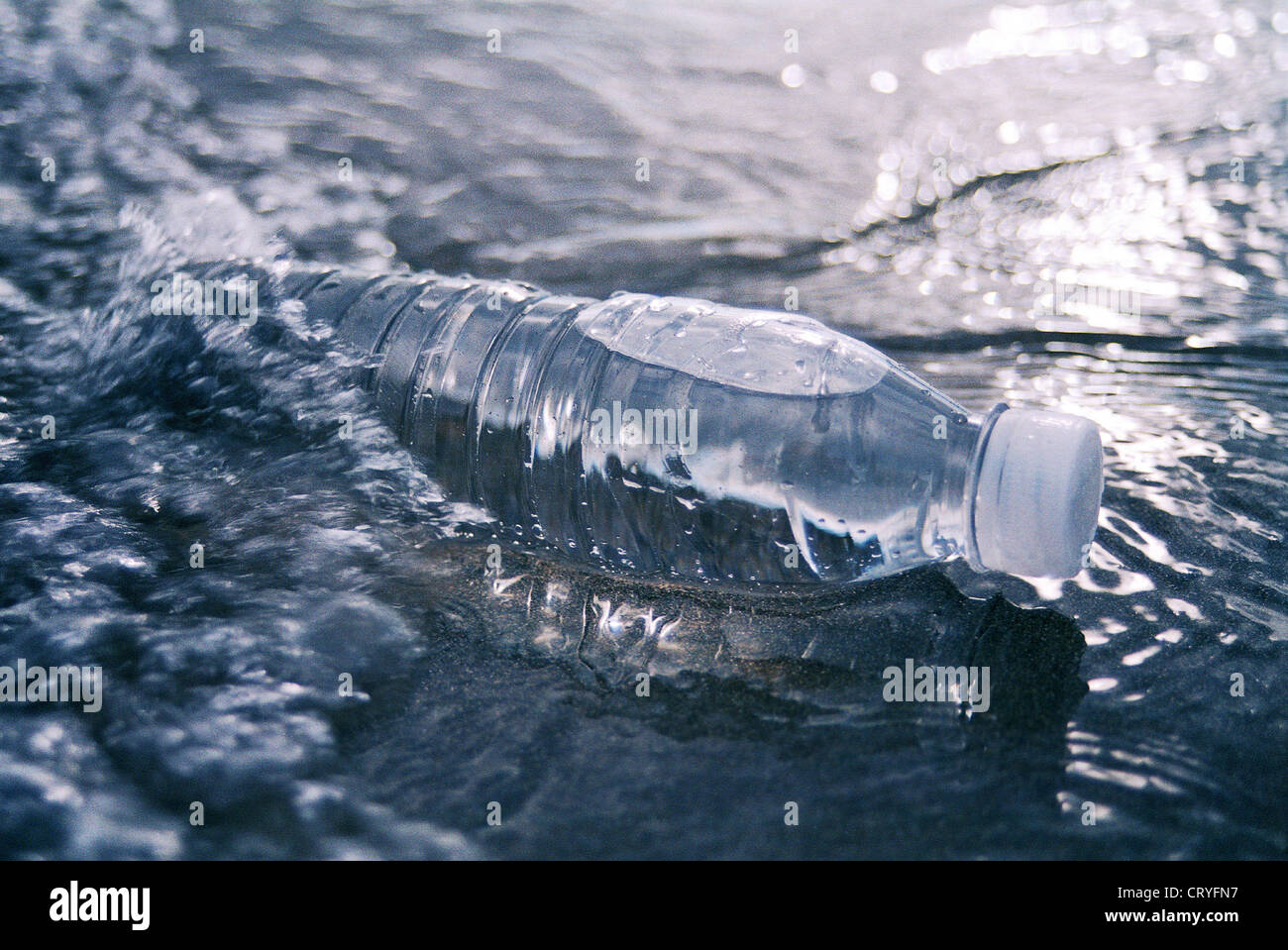 Water bottle on the beach Stock Photo - Alamy