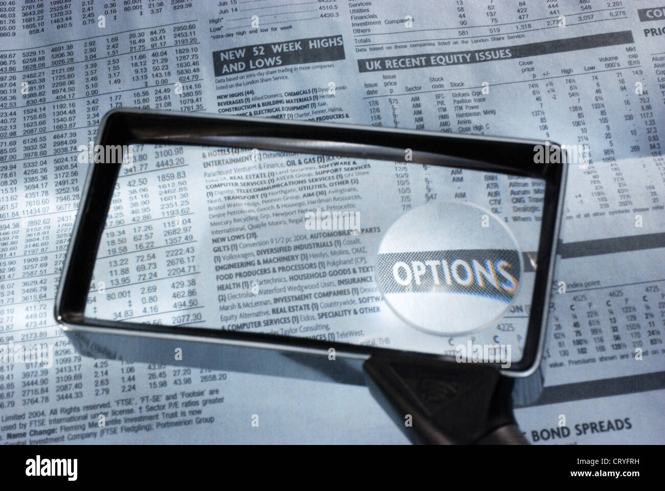 Magnifies Options from the stock market news Stock Photo - Alamy