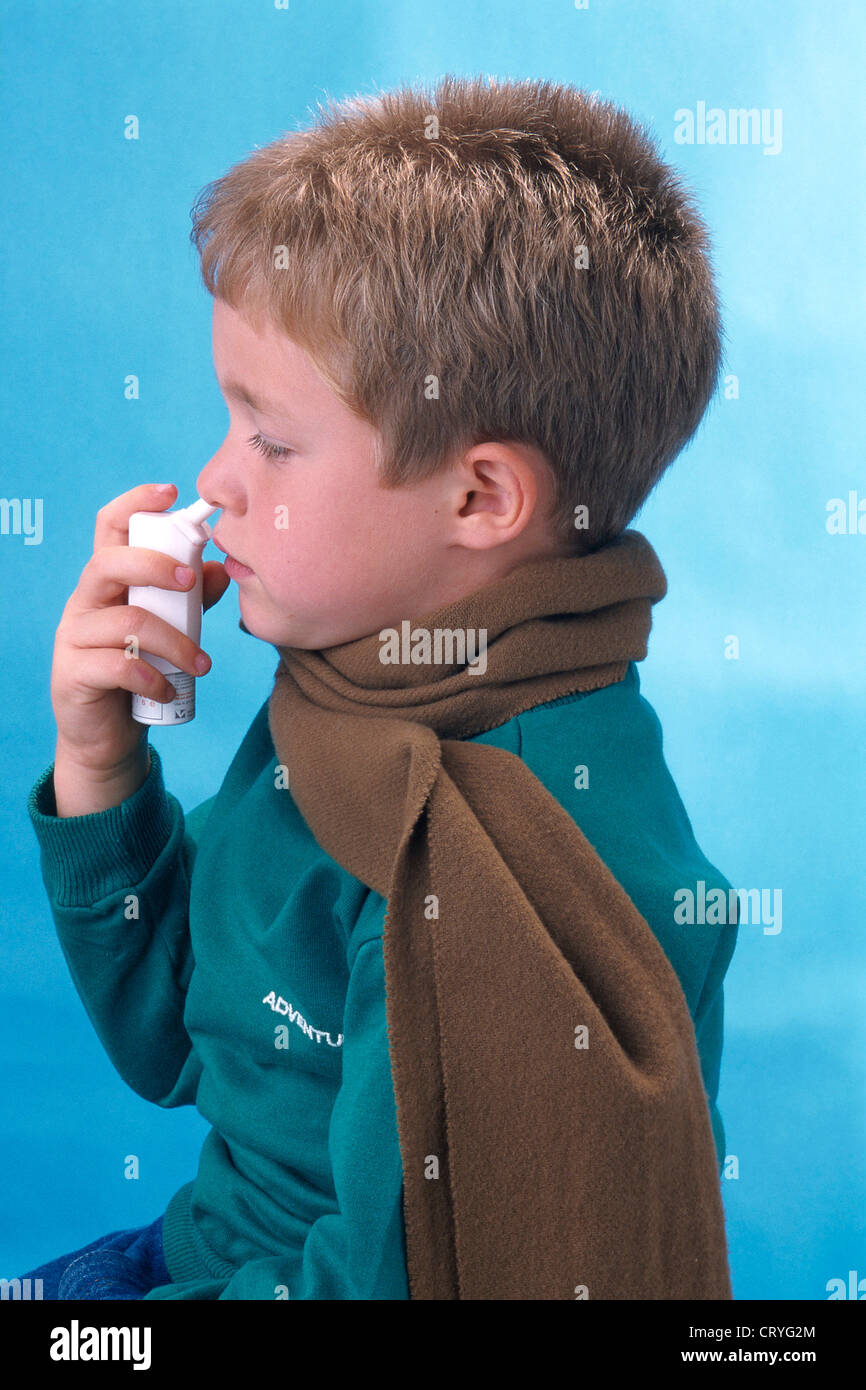CHILD USING NOSE SPRAY Stock Photo - Alamy