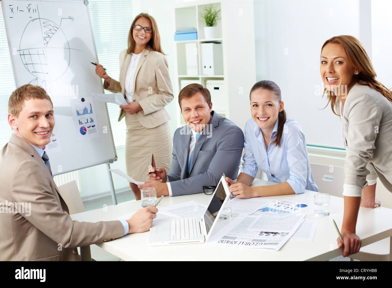 Image of confident partners looking at camera during presentation Stock ...