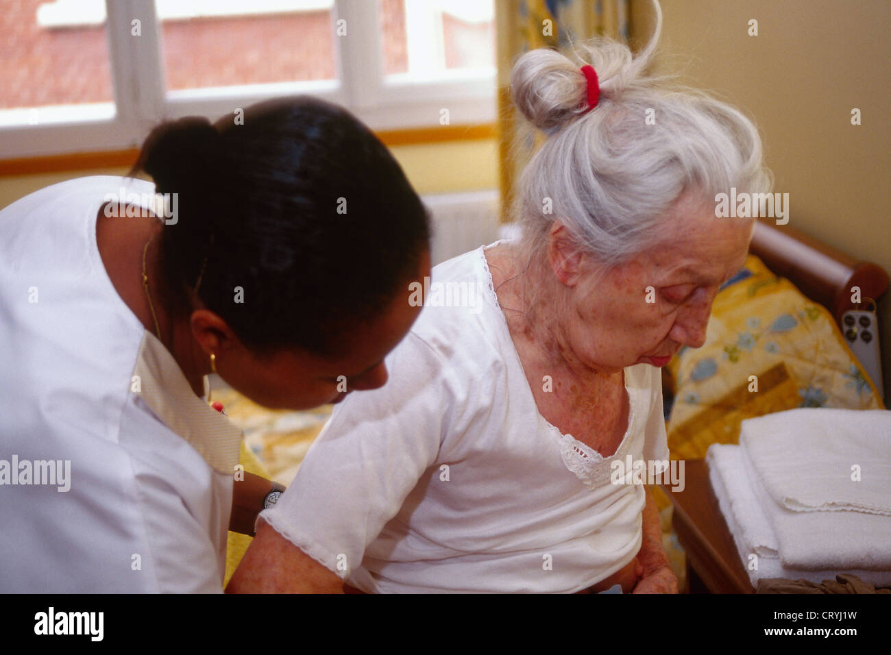 NURSE WASHING ELDERLY PERSON Stock Photo - Alamy