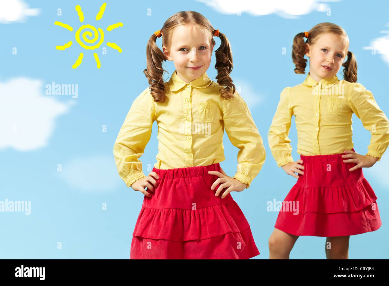 Portrait of two smart girls in smart clothes posing in front of camera ...