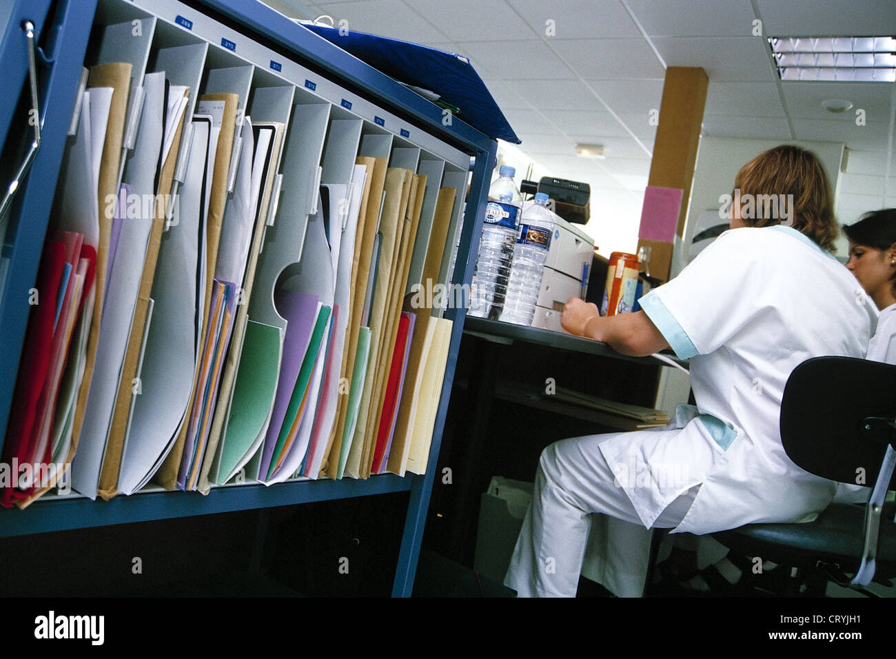 NURSE WITH PATIENT'S RECORD Stock Photo - Alamy