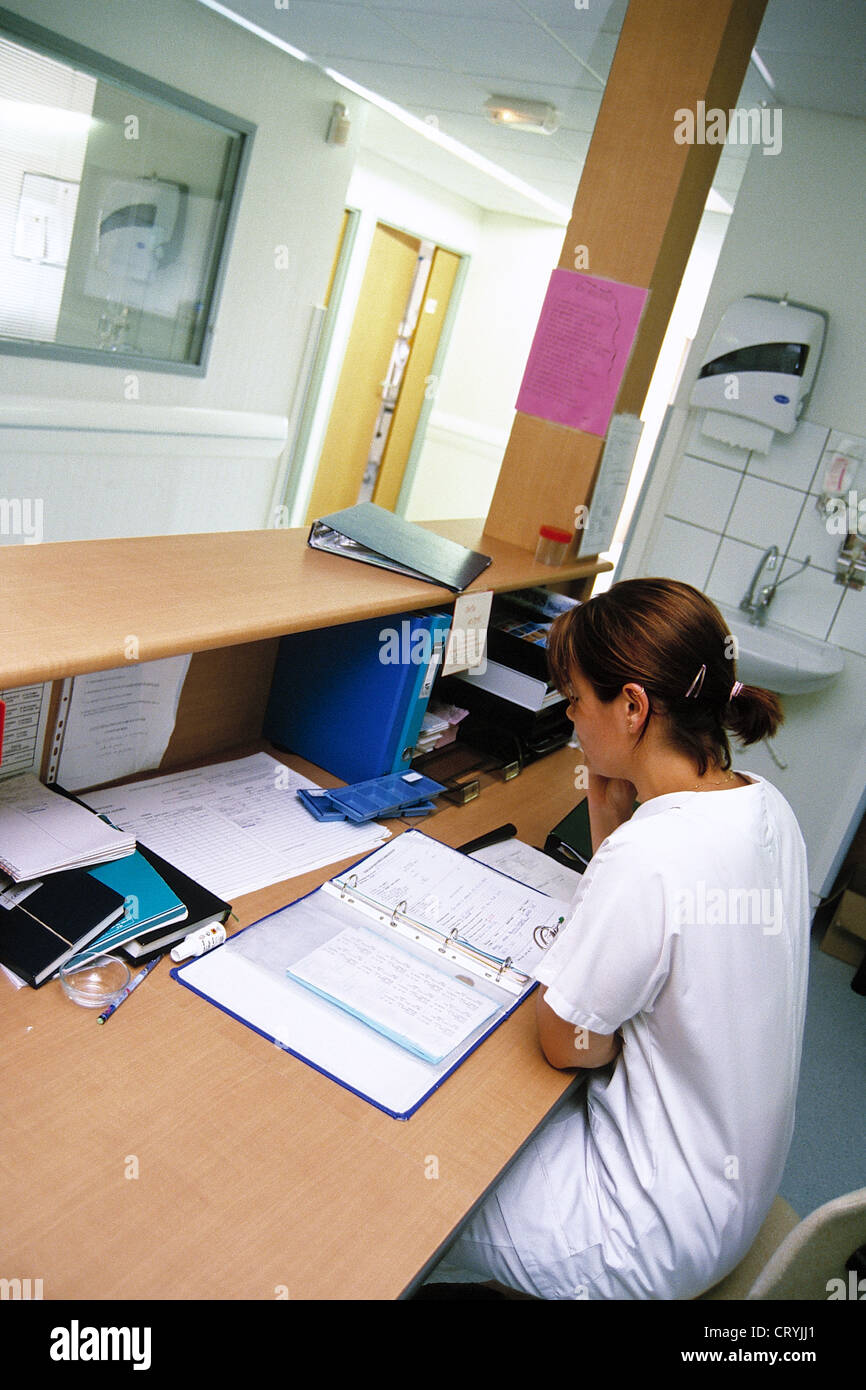NURSE WITH PATIENT'S RECORD Stock Photo - Alamy