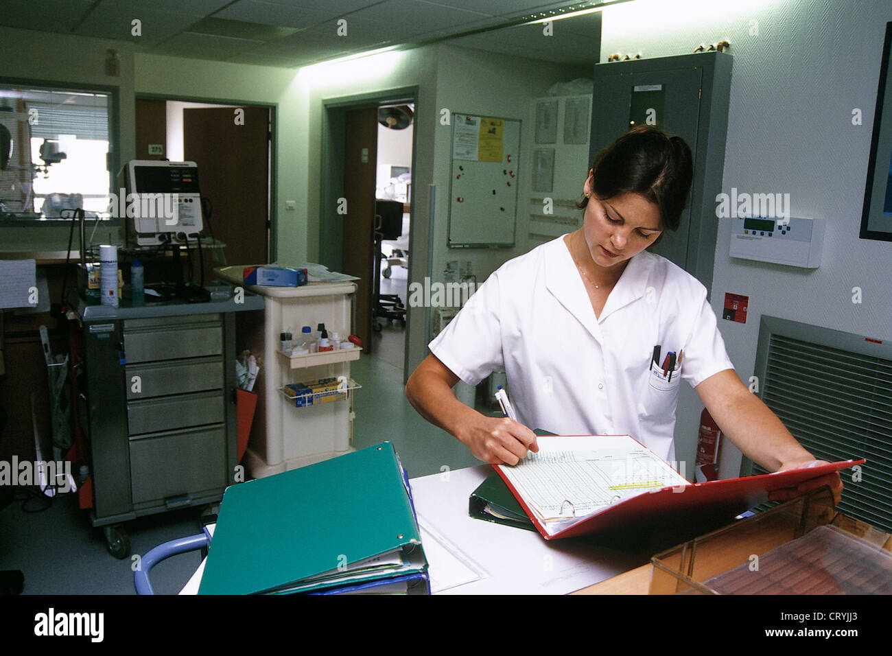 NURSE WITH PATIENT'S RECORD Stock Photo - Alamy