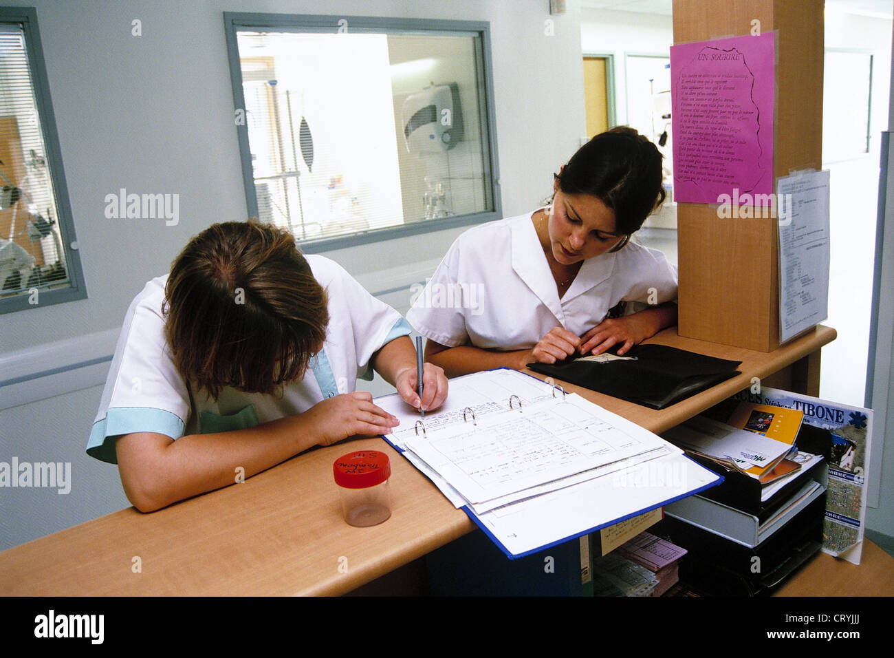 STUDENT NURSE W. PATIENT RECORD Stock Photo - Alamy