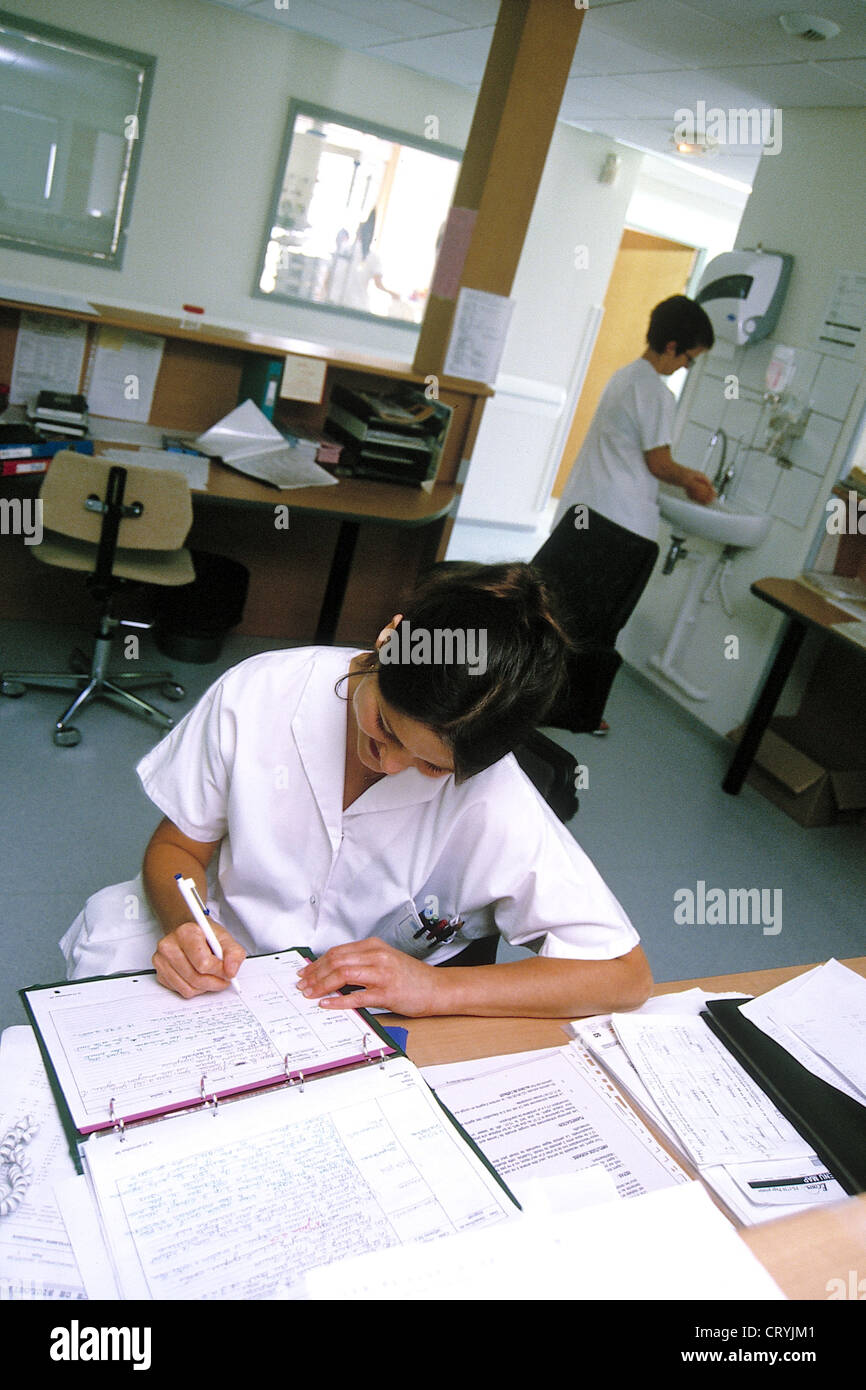 NURSE WITH PATIENT'S RECORD Stock Photo - Alamy