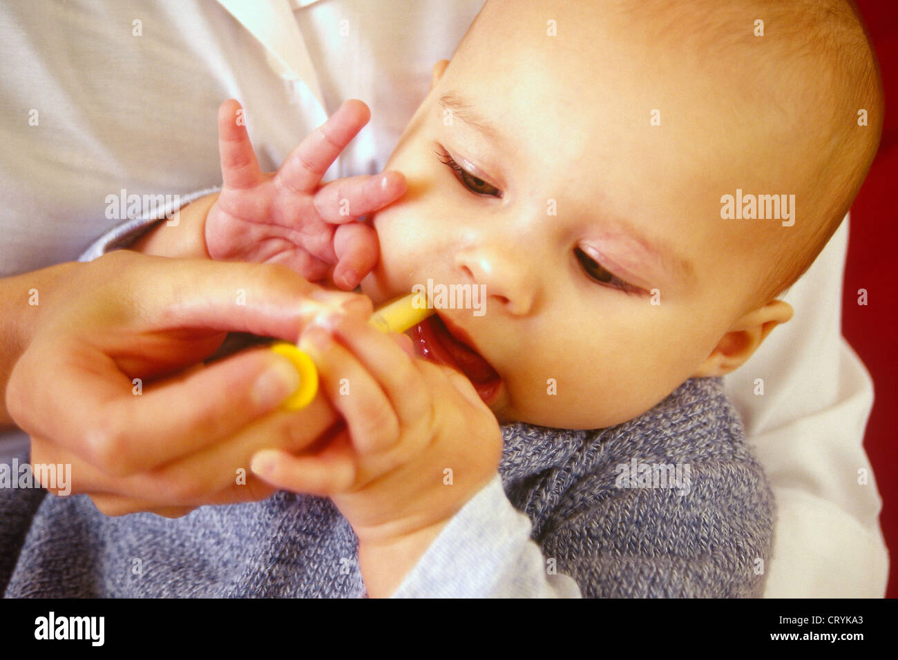 INFANT TAKING MEDICATION Stock Photo - Alamy