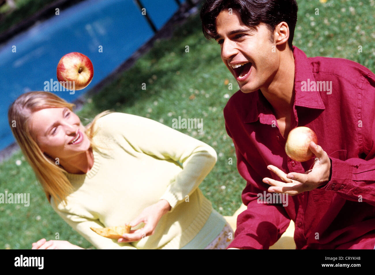 COUPLE EATING FRUIT Stock Photo - Alamy