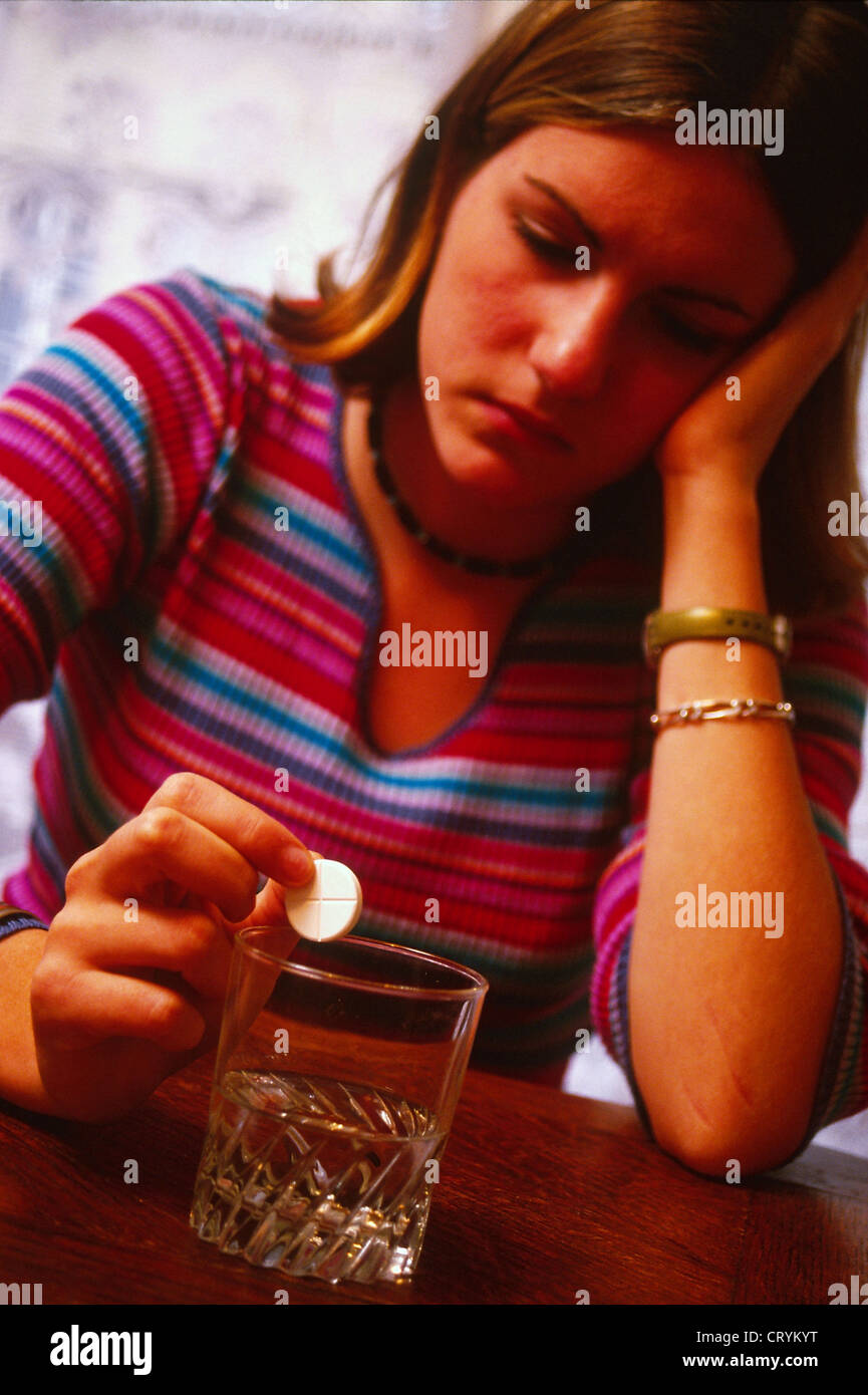 TEENAGER WITH ASPIRIN Stock Photo - Alamy