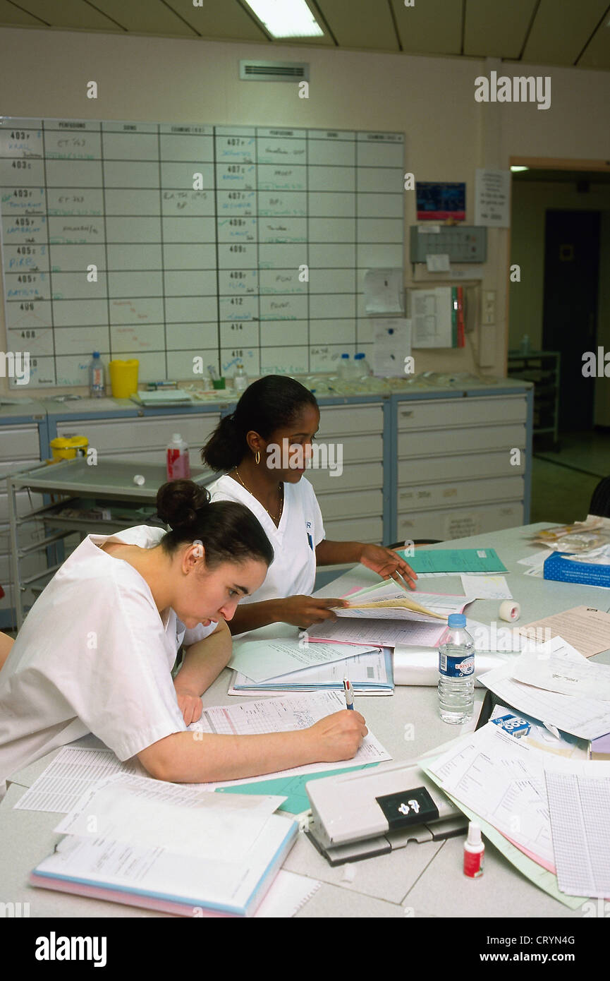 NURSE WITH PATIENT'S RECORD Stock Photo - Alamy