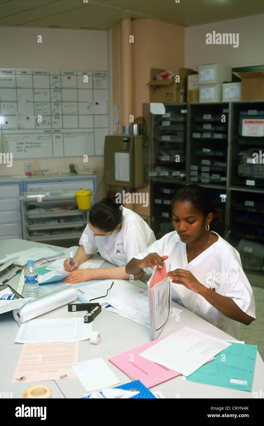 NURSE WITH PATIENT'S RECORD Stock Photo - Alamy