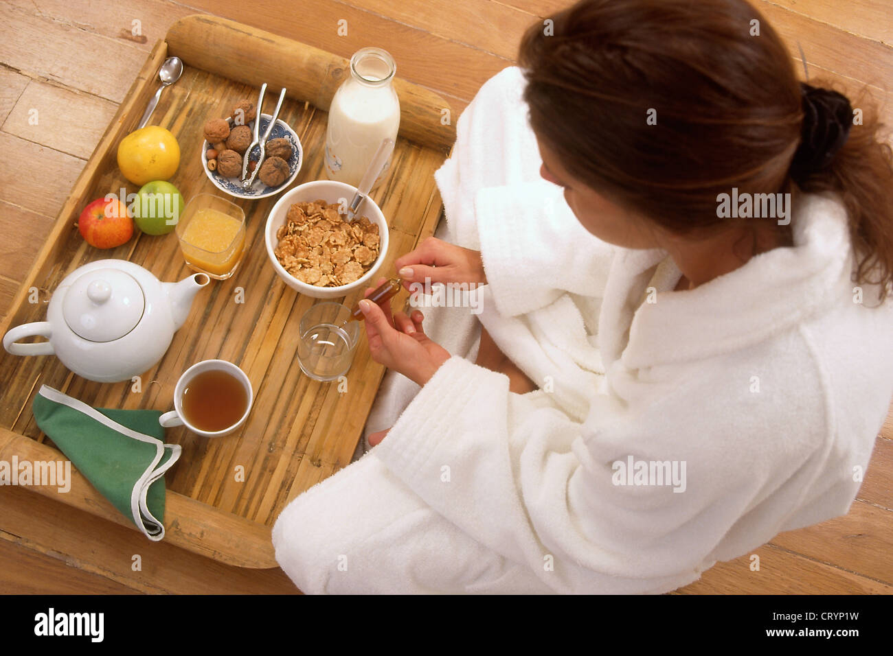 WOMAN EATING BREAKFAST Stock Photo - Alamy