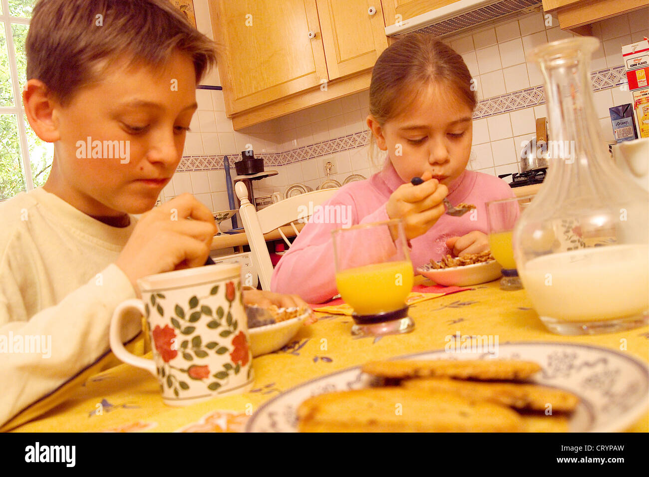 CHILD EATING BREAKFAST Stock Photo - Alamy