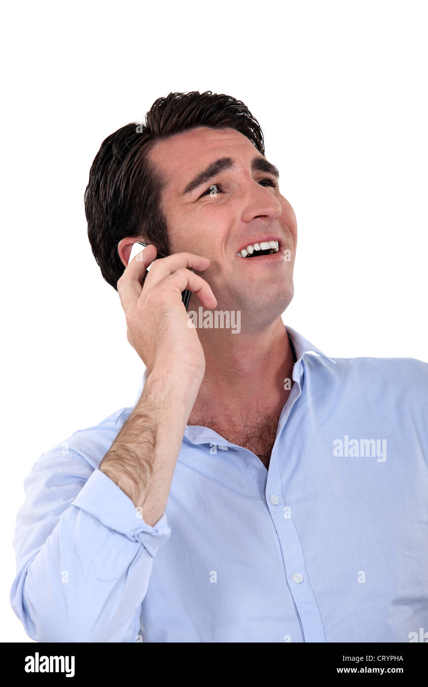 A businessman laughing over the phone Stock Photo - Alamy