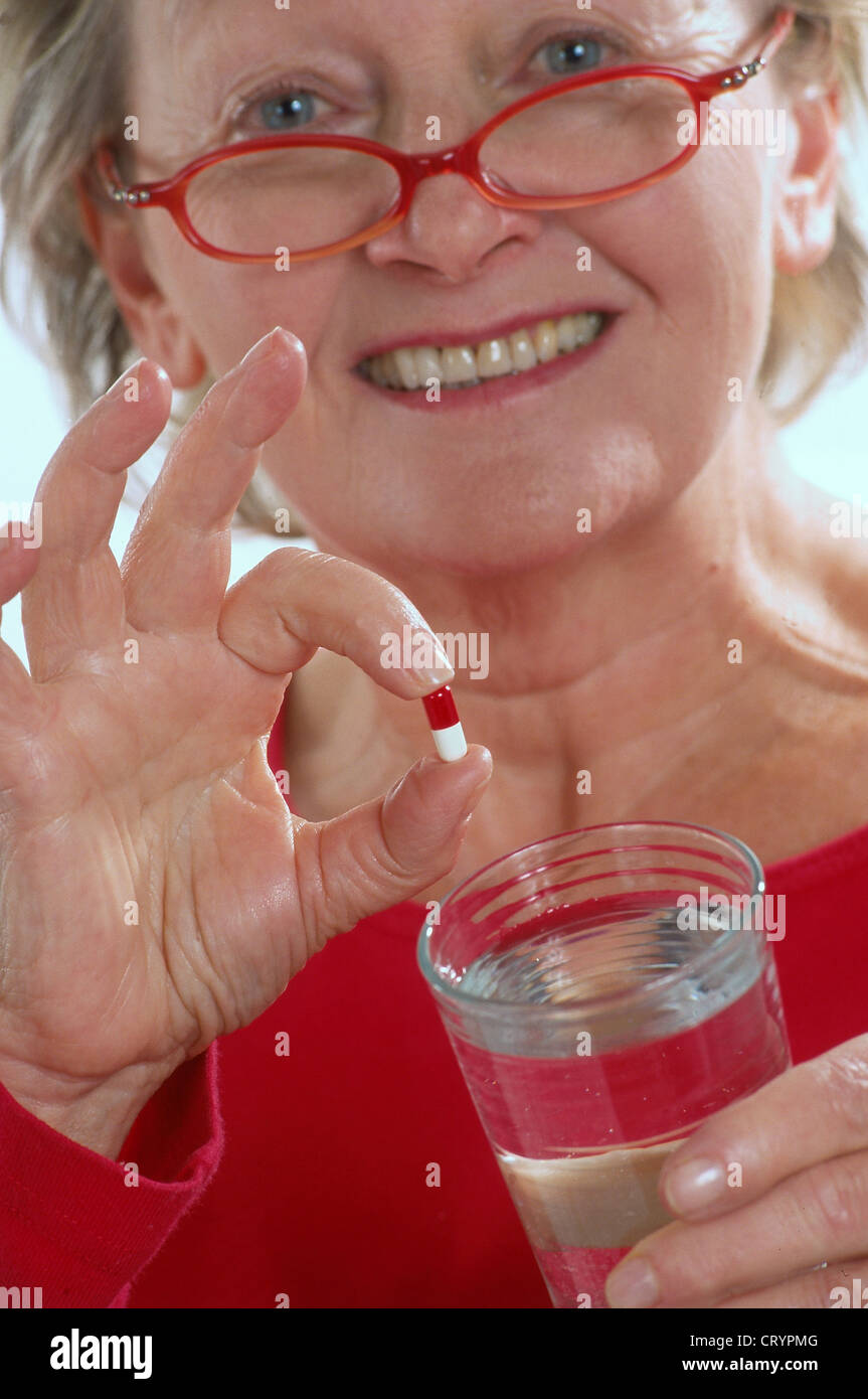 ELDERLY PERSON TAKING MEDICATION Stock Photo - Alamy